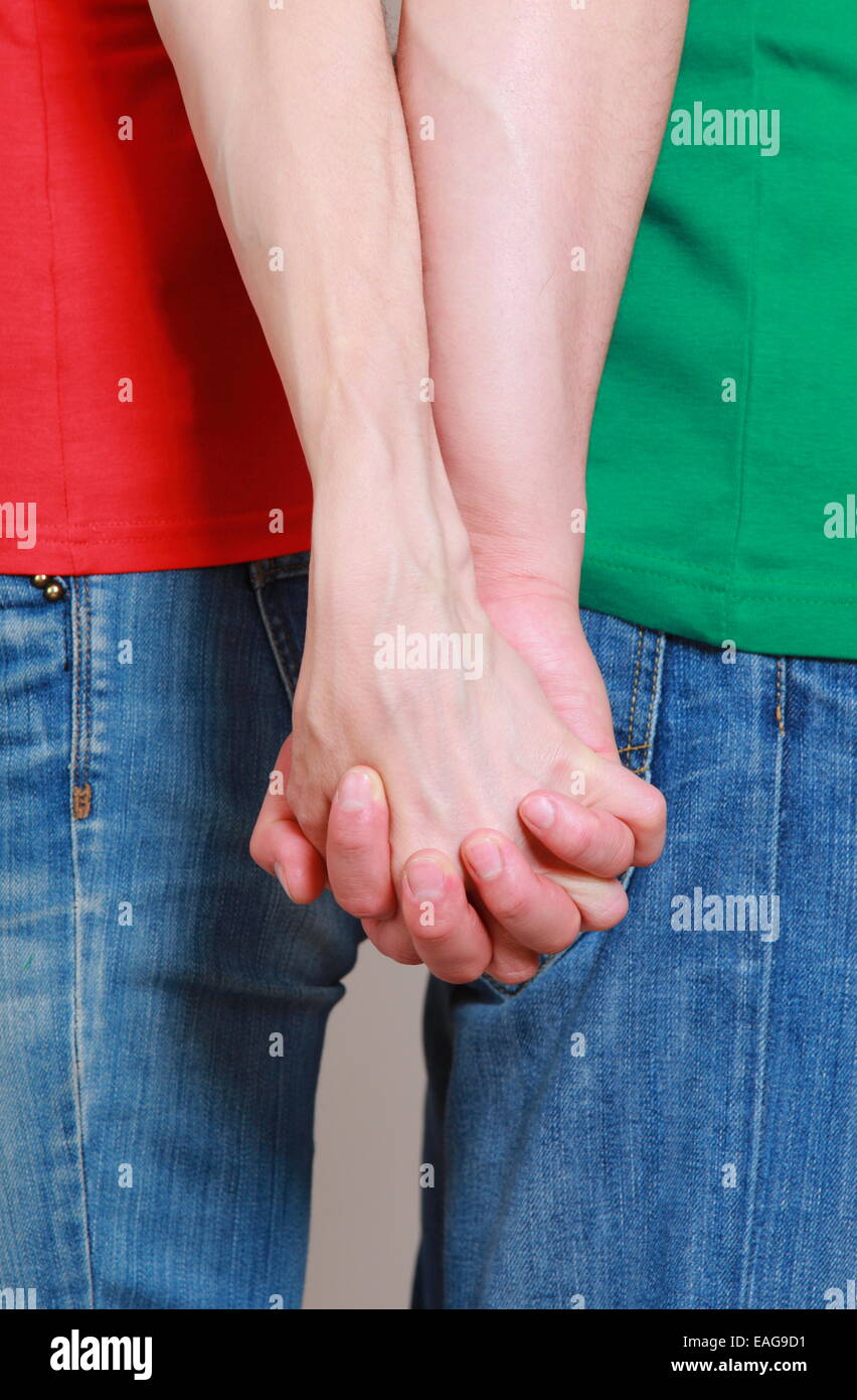 Hands of man and woman in handshake, couple holding hands Stock Photo ...