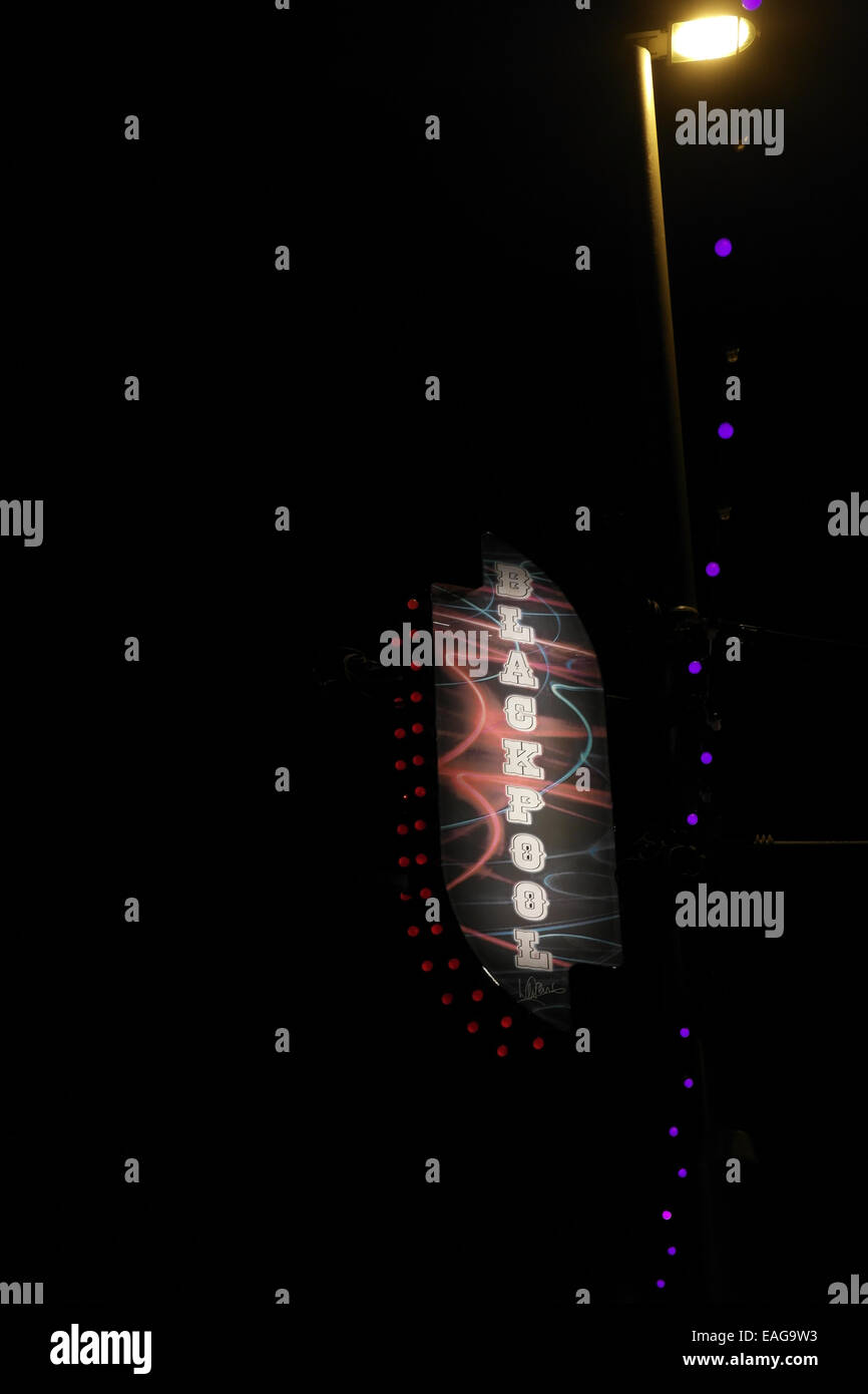 Night portrait illuminated 'Blackpool Sign' attached roadside lamp-post ...