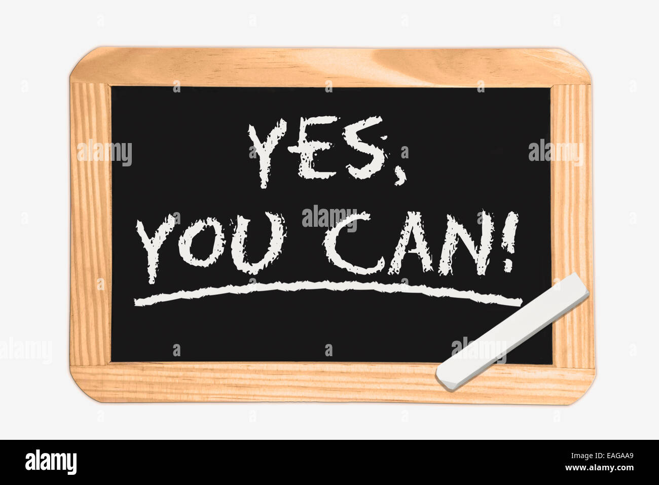 Blackboard with the inscription Yes You Can, a piece of white chalk in ...