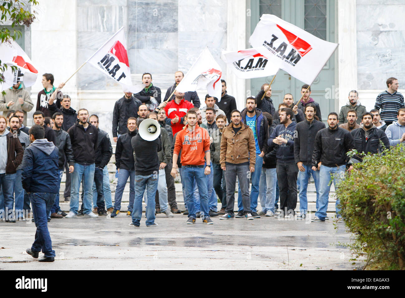 Students wave flags of the Communist Student Union MAS (Front of ...