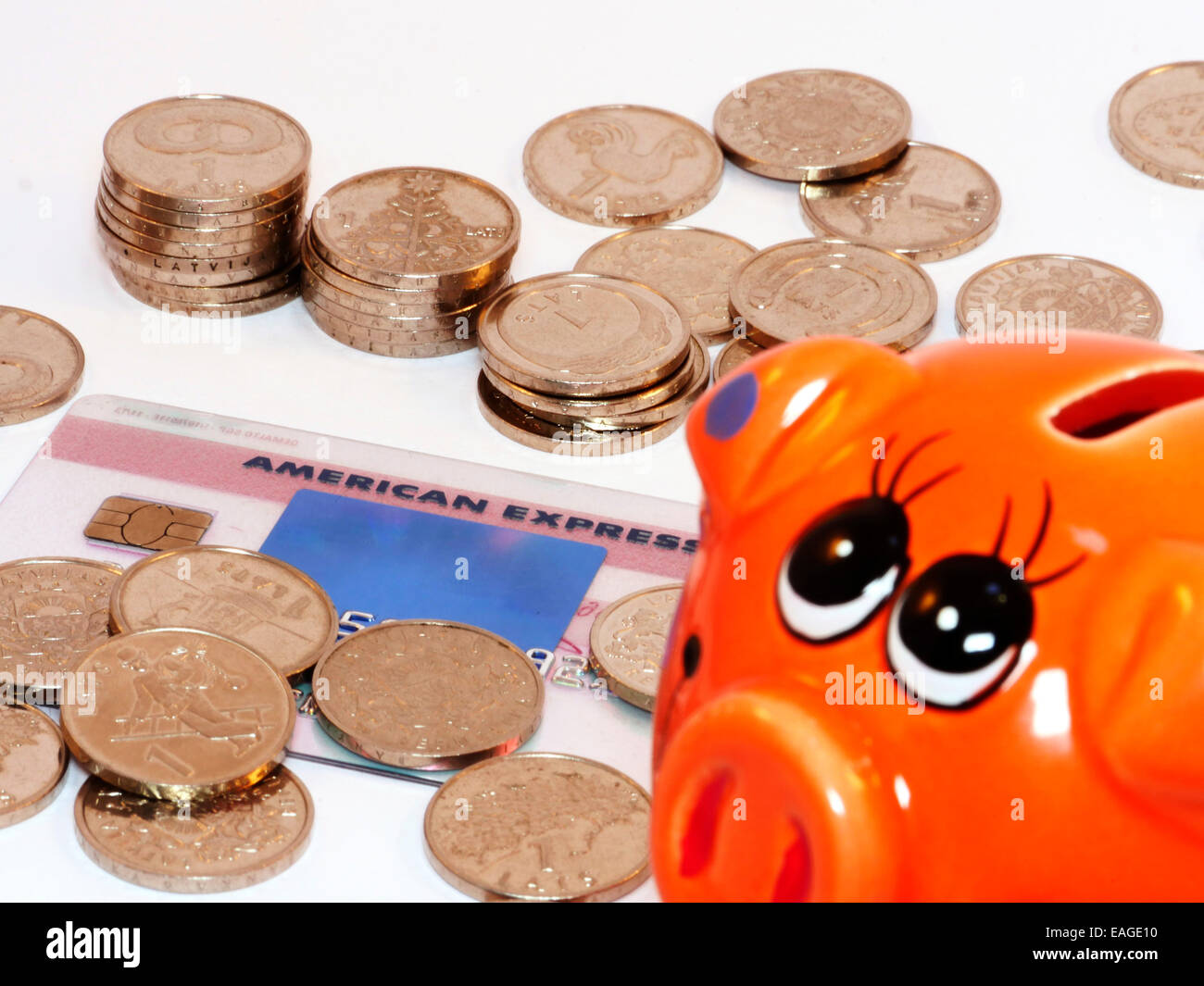 Bunch of Latvian lat coins and piggy bank on white background Stock ...