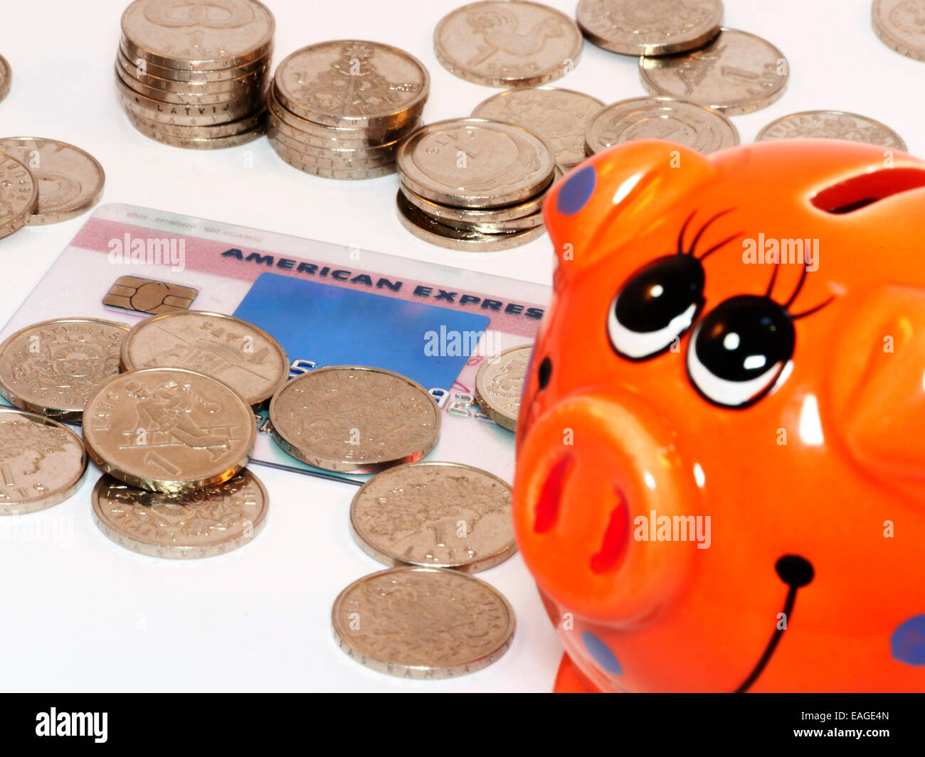 Bunch of Latvian lat coins and piggy bank on white background Stock ...
