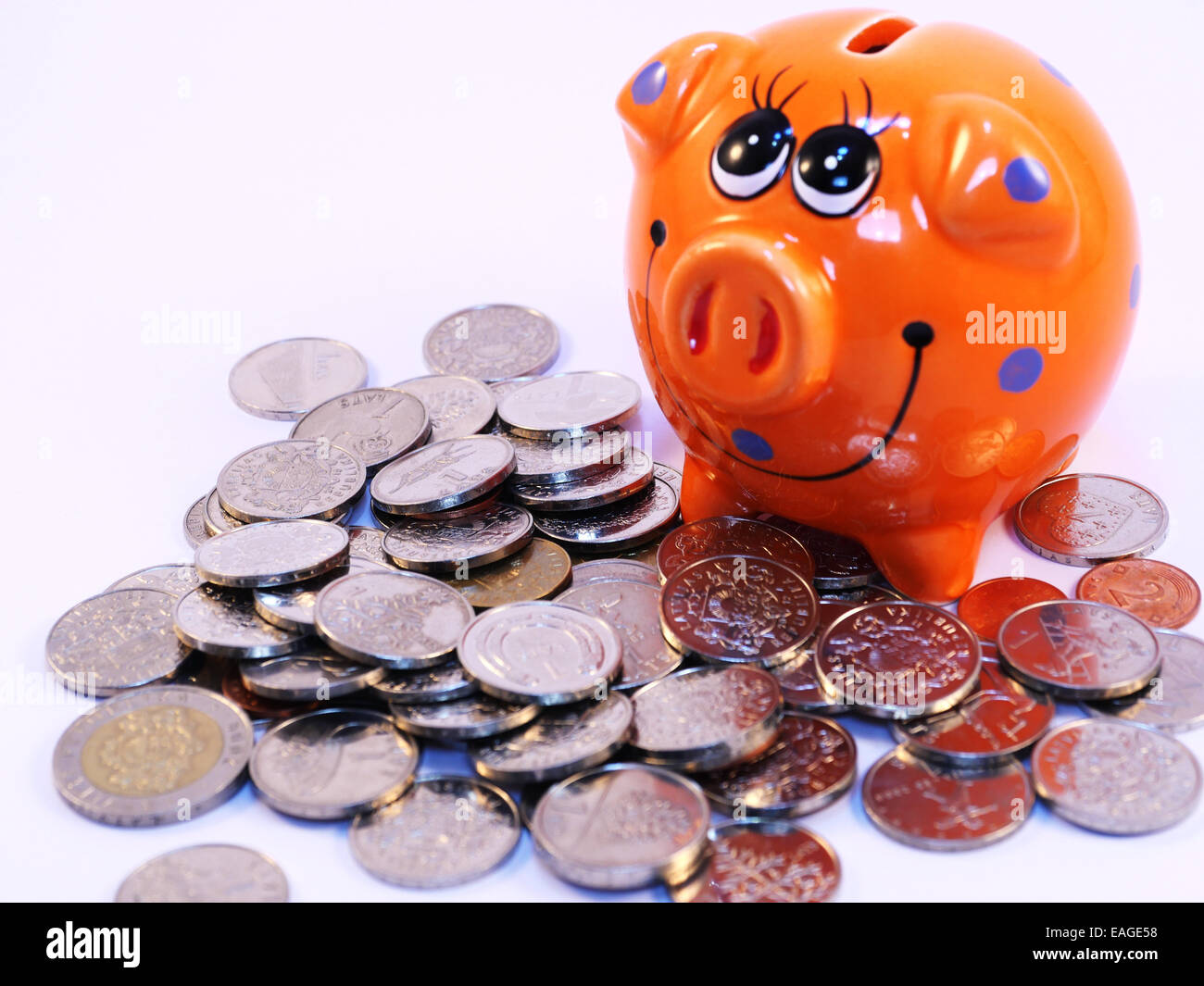 Bunch of Latvian lat coins and piggy bank on white background Stock ...
