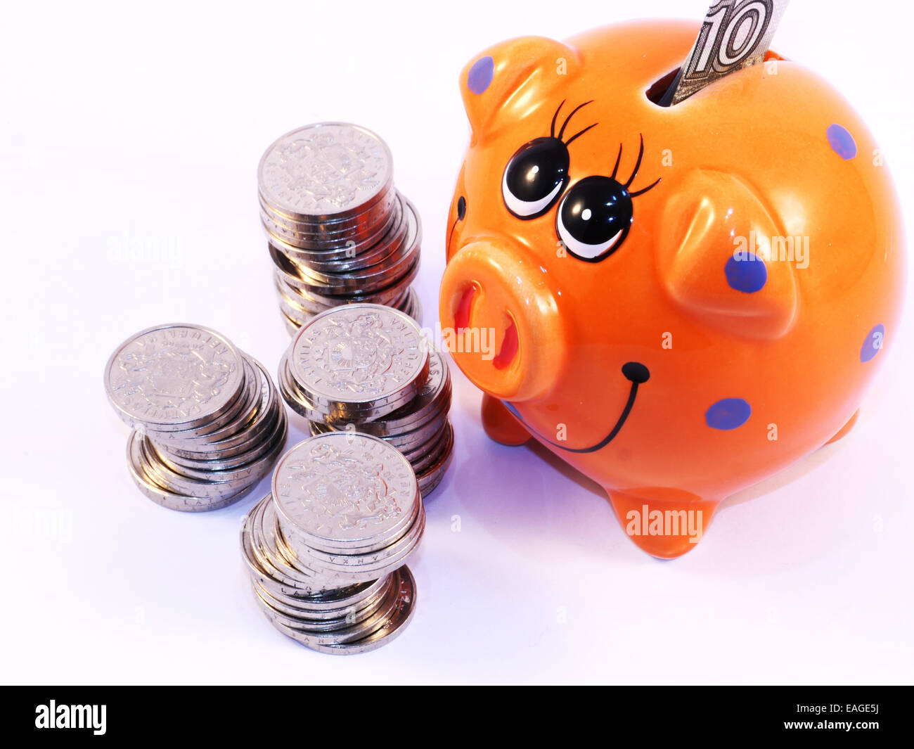Bunch of Latvian lat coins and piggy bank on white background Stock ...