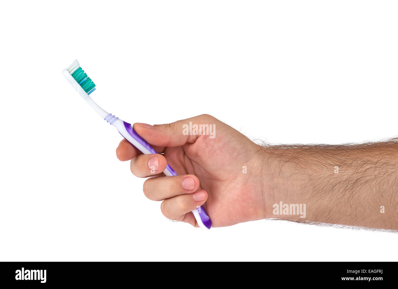 Toothbrush in hand isolated over white background Stock Photo - Alamy