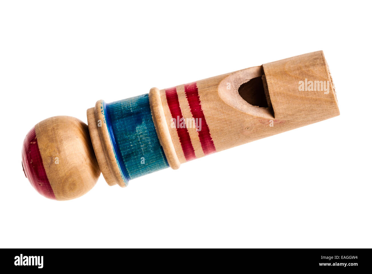 a small wooden whistle isolated over a white background Stock Photo - Alamy