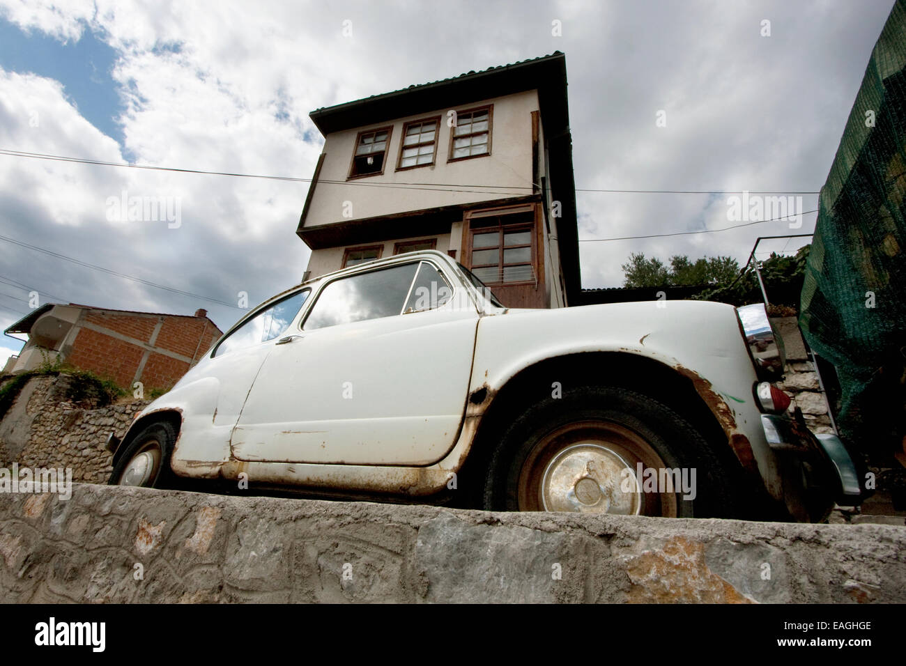 Rusting Car By A House, Ohrid, Macedonia Stock Photo - Alamy