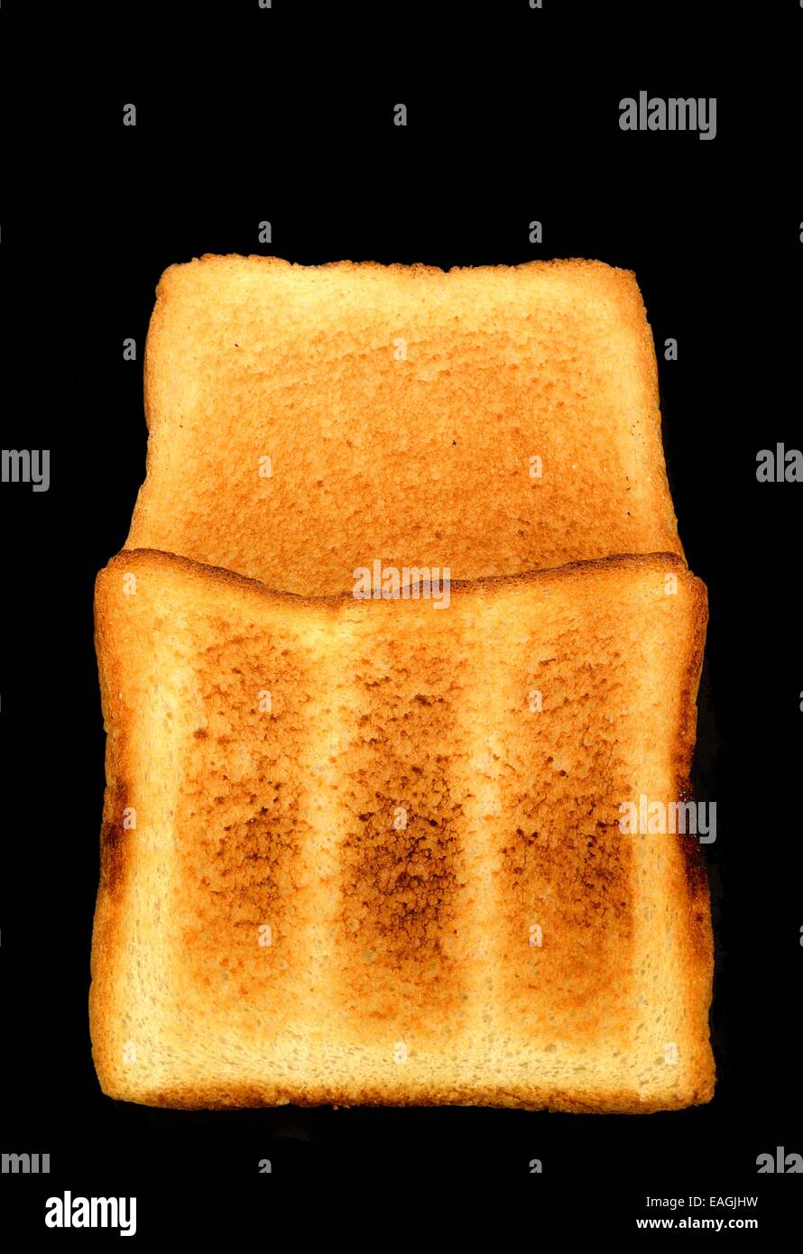 Slice of white toast on a black background Stock Photo - Alamy
