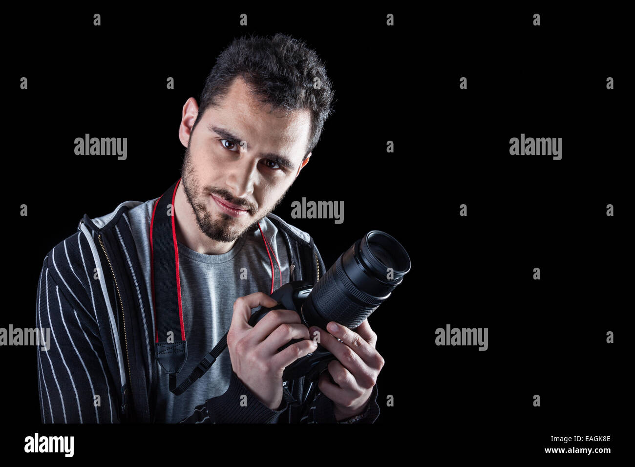 an handsome photographer isolated on a black background Stock Photo - Alamy