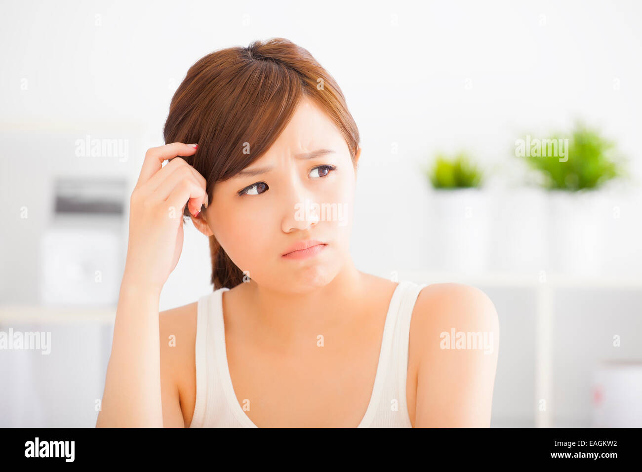 closeup confuse young asian woman Stock Photo - Alamy