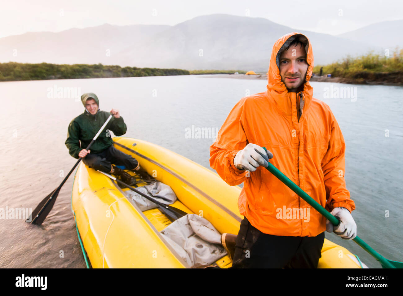 Man on raft with paddle hi-res stock photography and images - Alamy