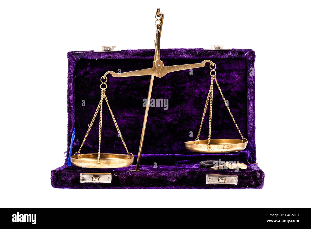 a small golden scale isolated over a white background Stock Photo - Alamy