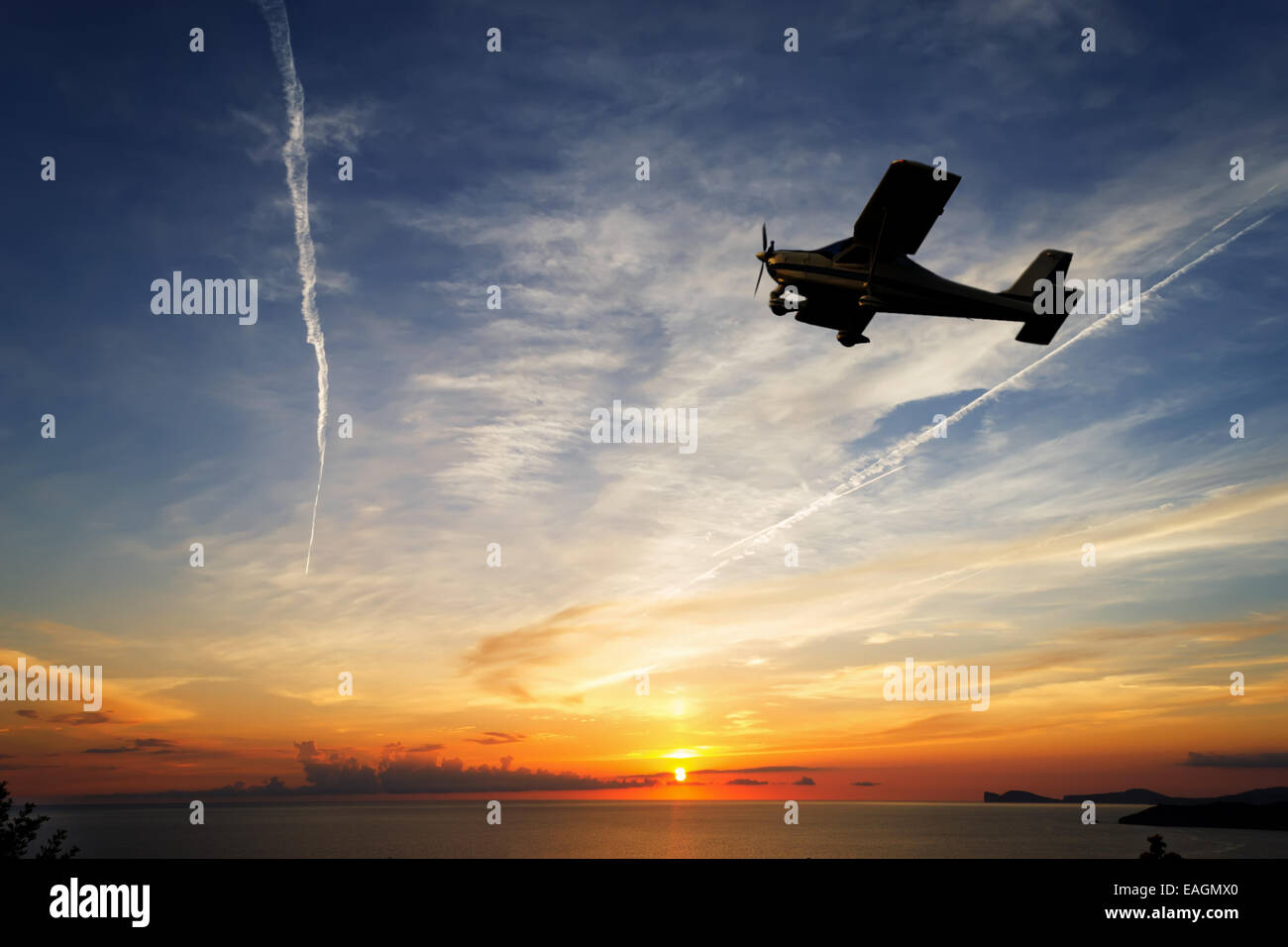 single engine airplane flying at sunset Stock Photo - Alamy