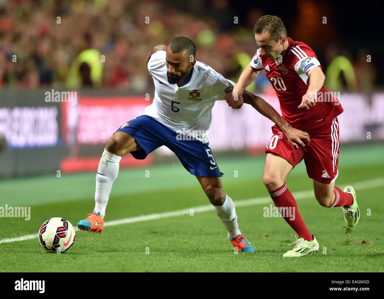 Faro, Portugal. 14th Nov, 2014. Portugal's Jose Bosingwa (L) vies for ...