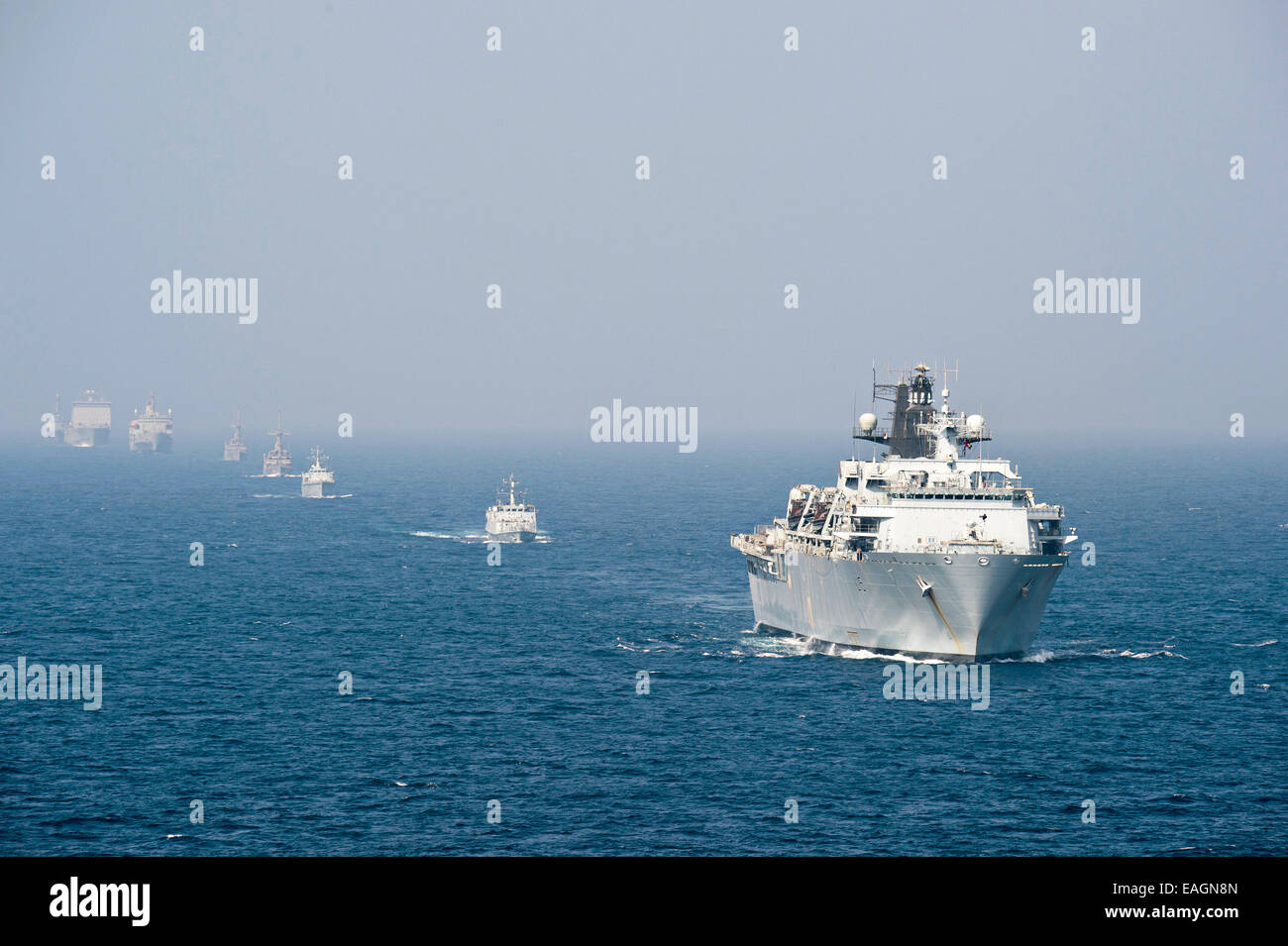 Navy ships led by the Royal Navy HMS Bulwark steam in formation during ...