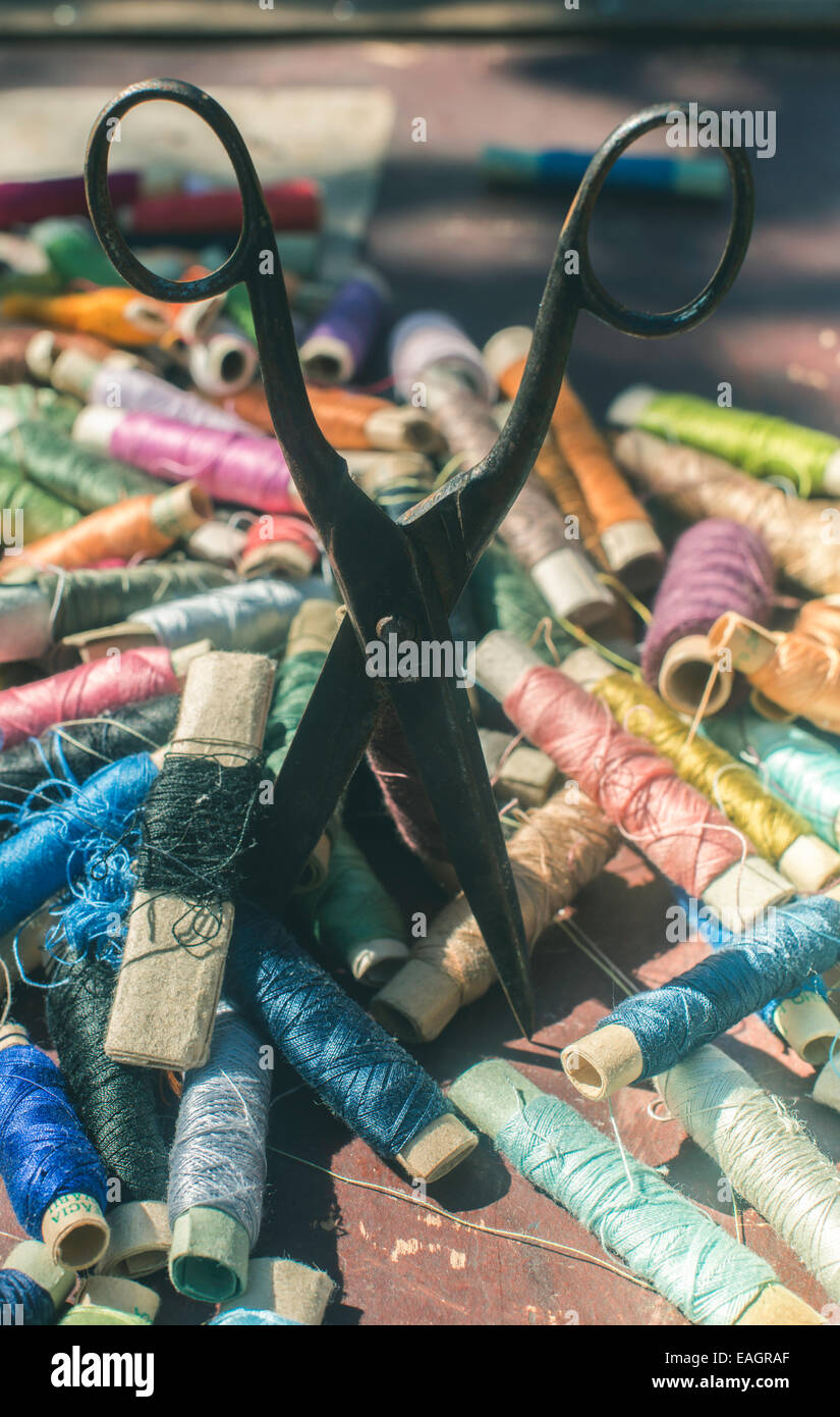 Vintage sewing thread and scissors Stock Photo - Alamy