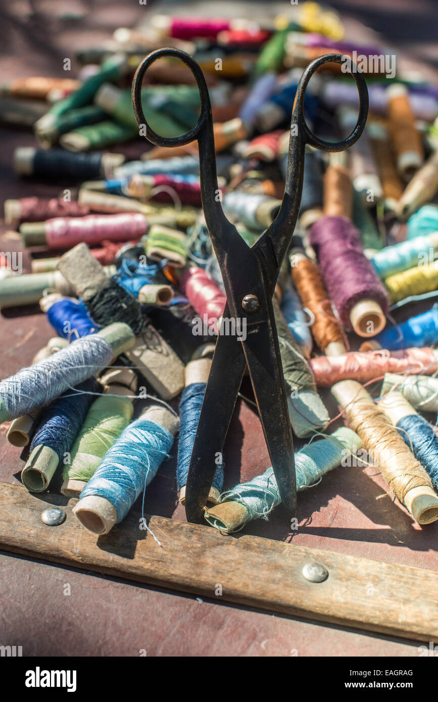 Vintage sewing thread and scissors Stock Photo - Alamy