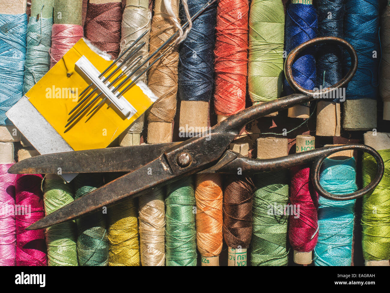 Vintage sewing thread and scissors Stock Photo - Alamy