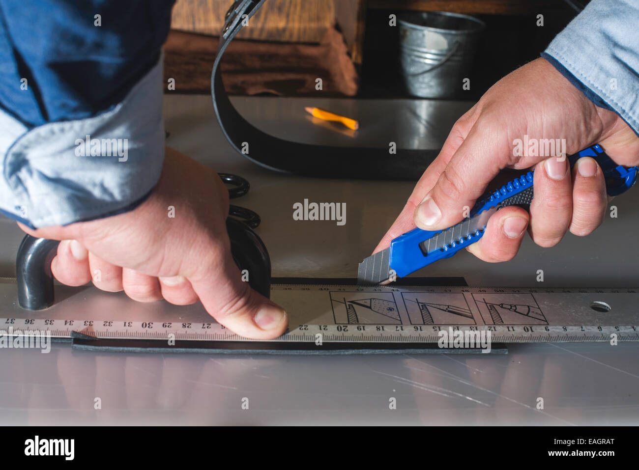 Cutting leather handmade Stock Photo - Alamy