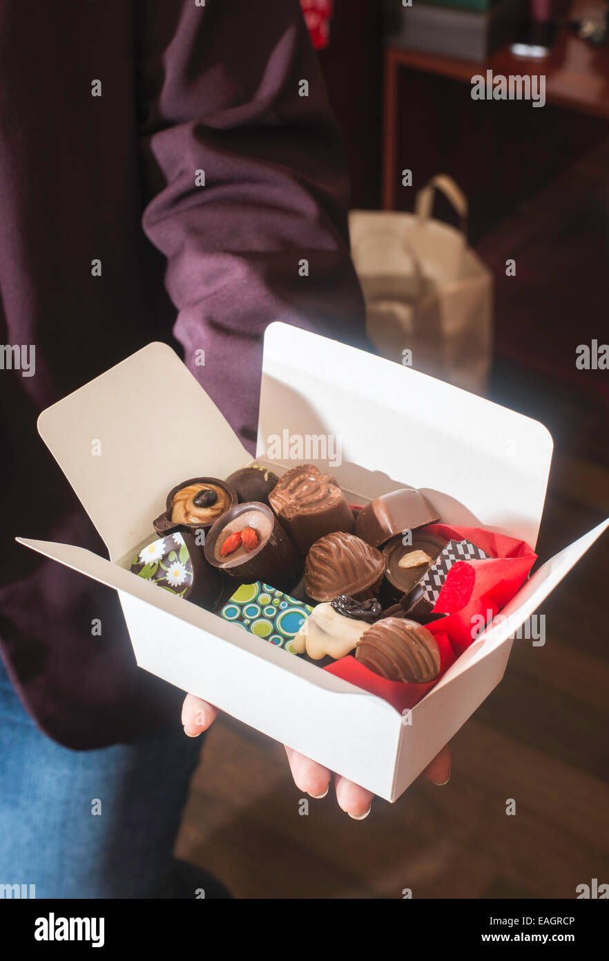 Hand holding candy hi-res stock photography and images - Alamy
