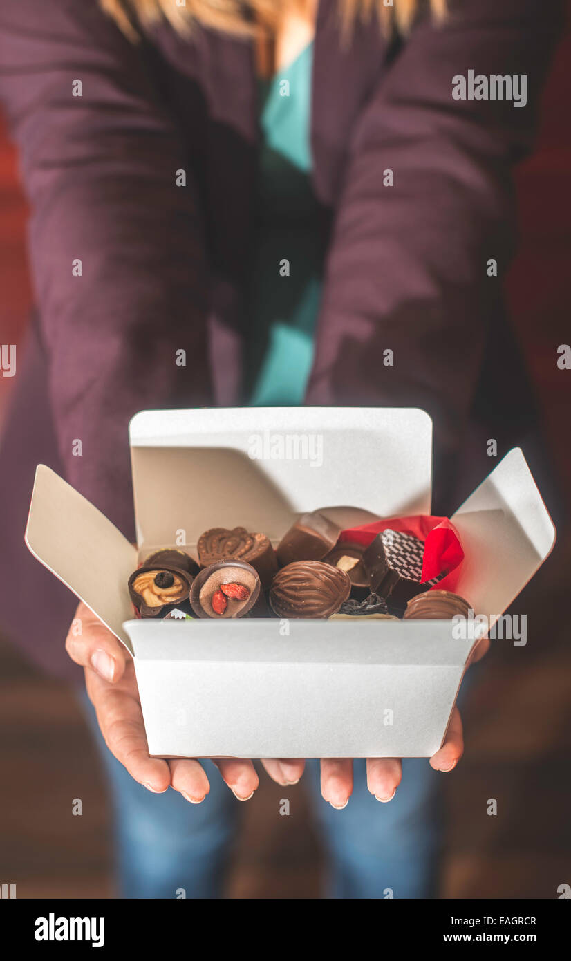 Hand holding chocolate box hi-res stock photography and images - Alamy