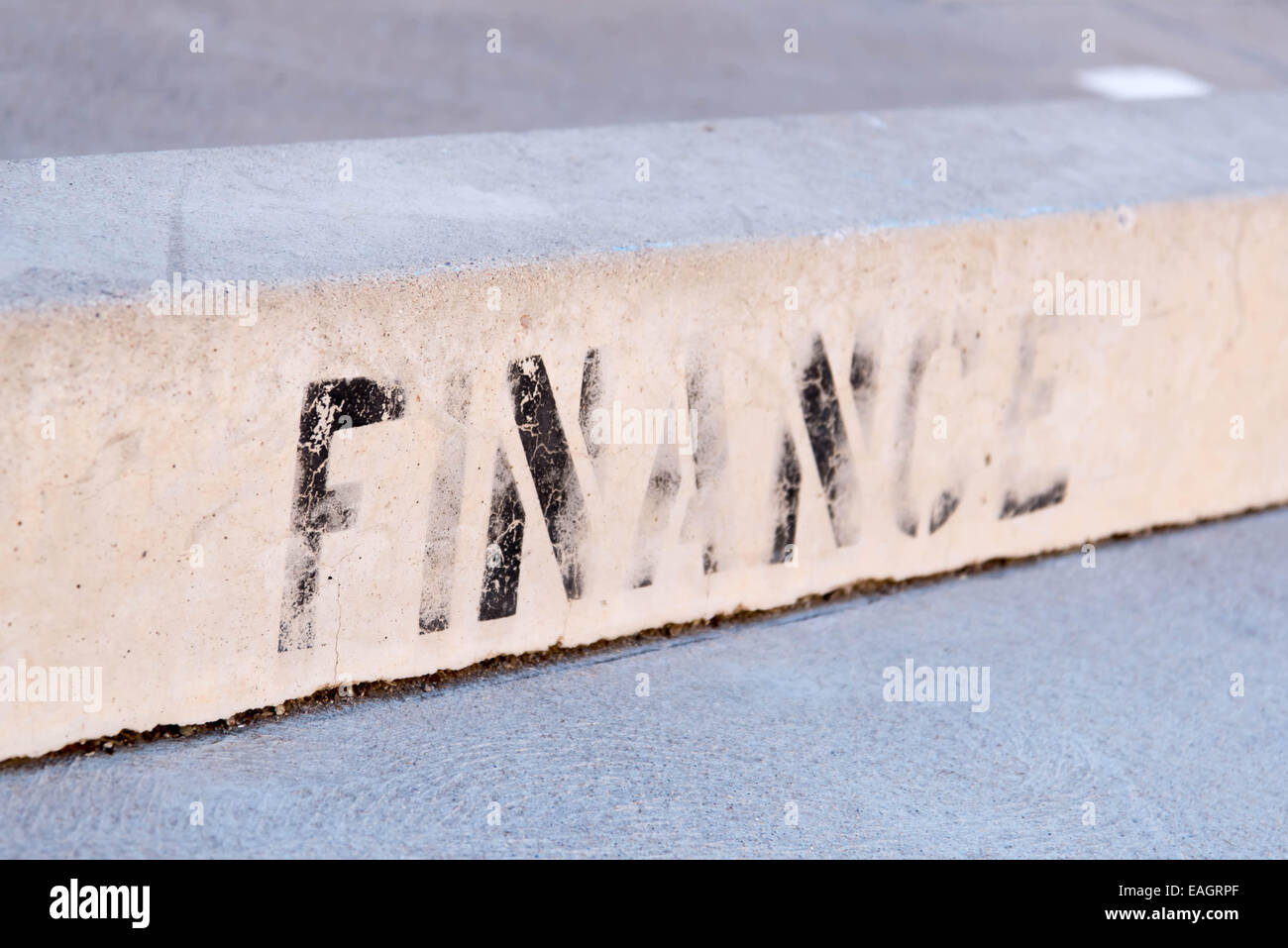 finance reserved parking block with painted worn letters Stock Photo ...