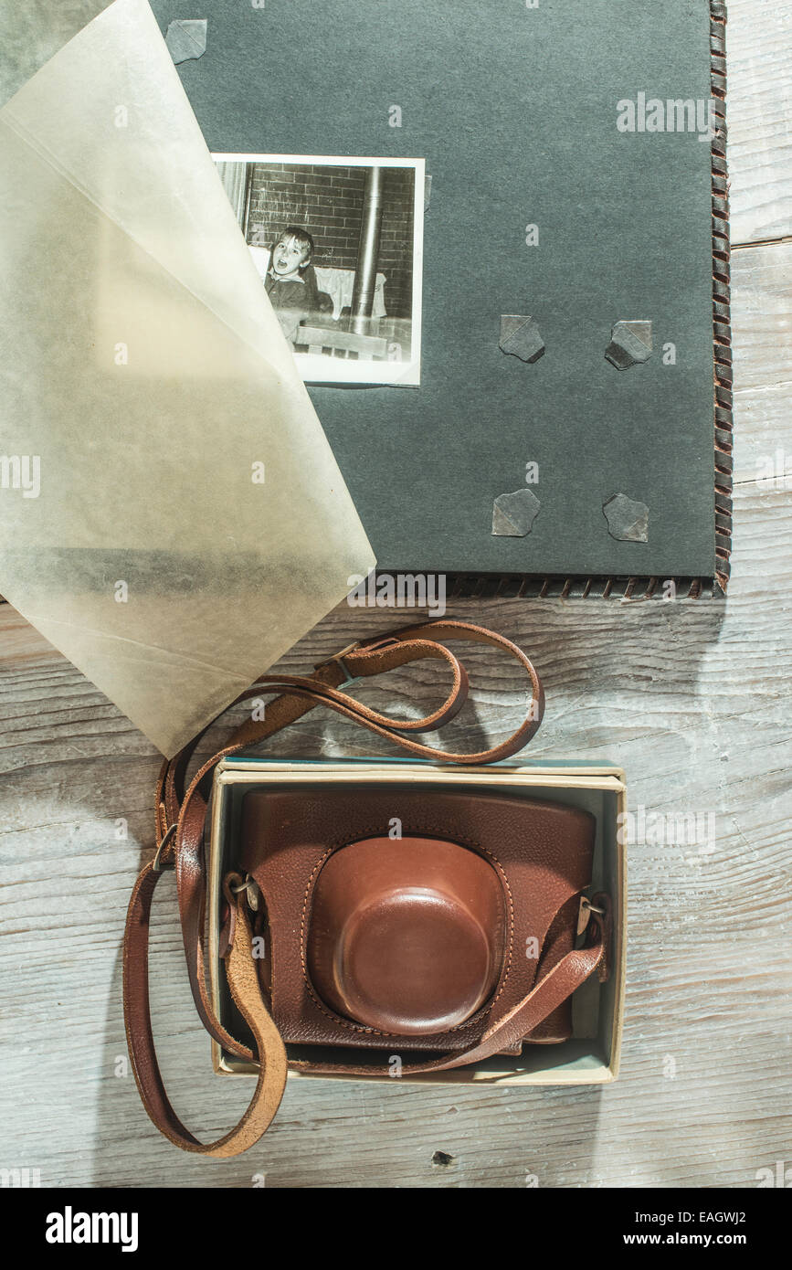 Vintage photo camera and album on white wooden background Stock Photo ...