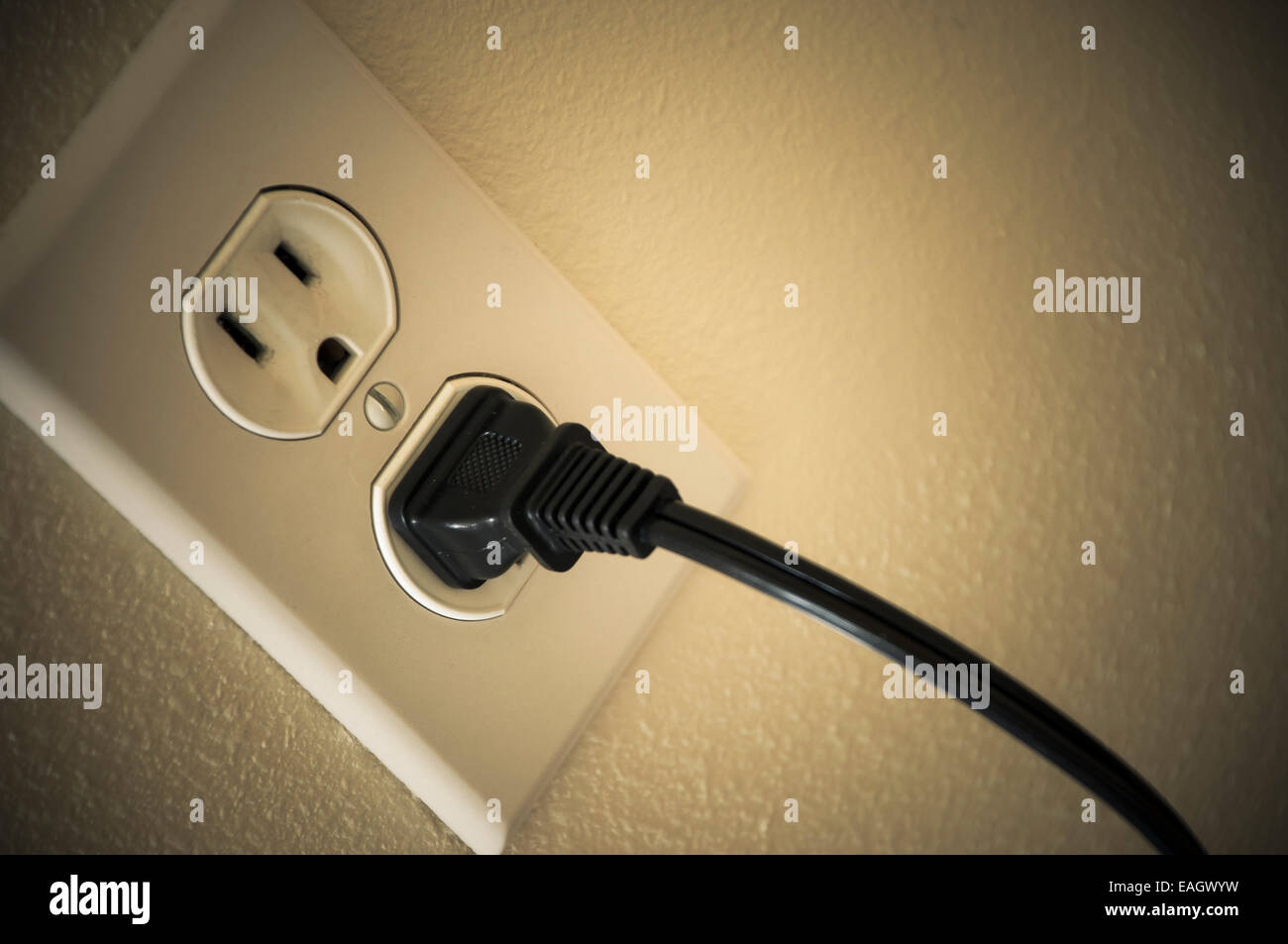 Plugged into outlet hi-res stock photography and images - Alamy