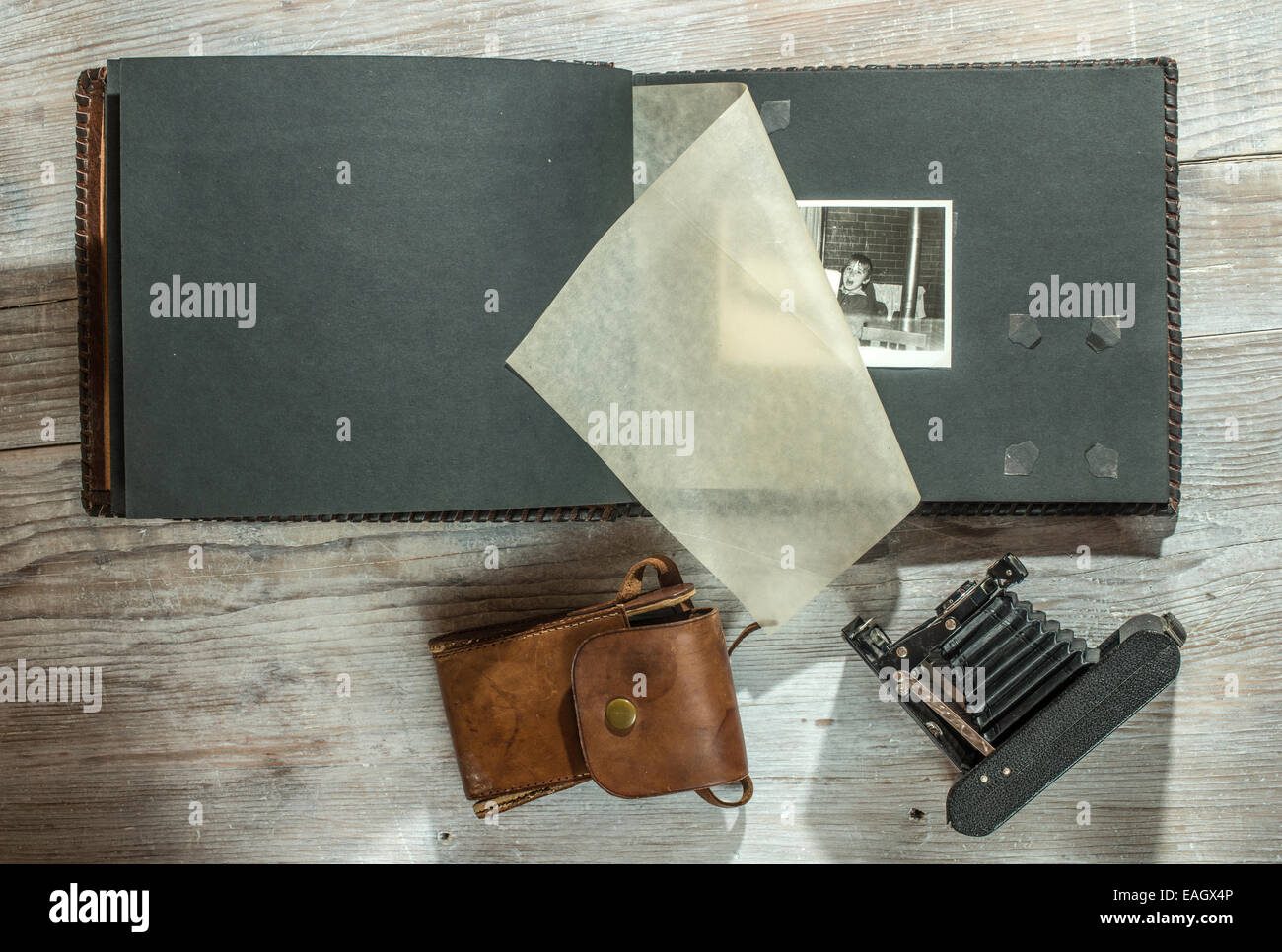 Vintage photo camera and album on white wooden background Stock Photo ...