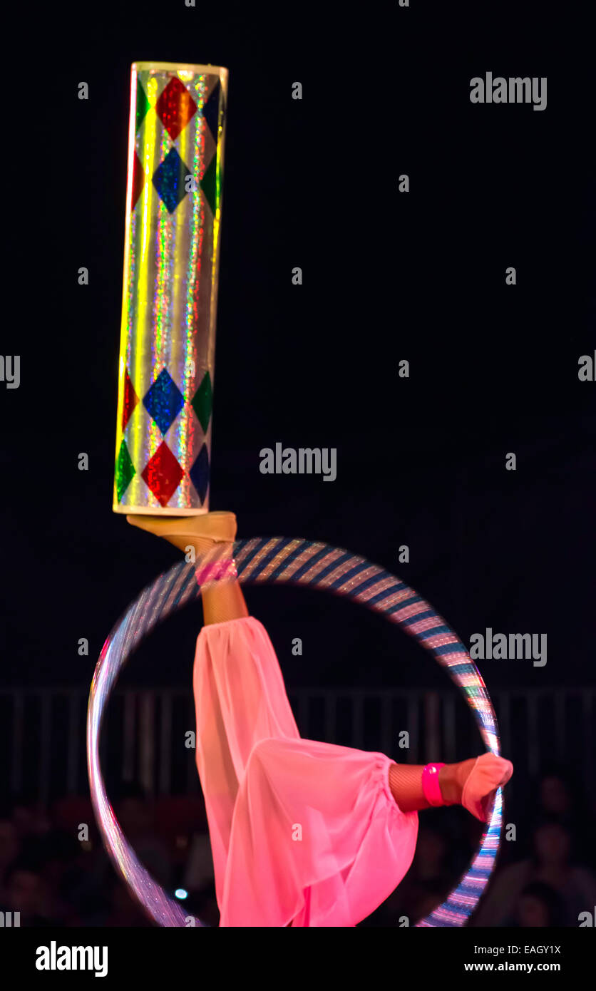 Juggler in the circus on black background Stock Photo - Alamy
