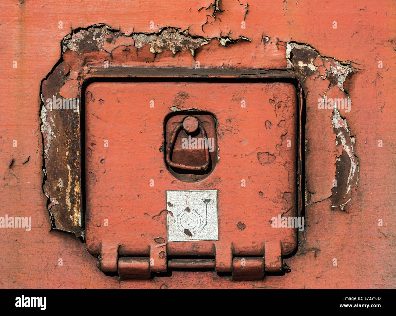 Red cracked paint on rusty iron. Sun light Stock Photo - Alamy