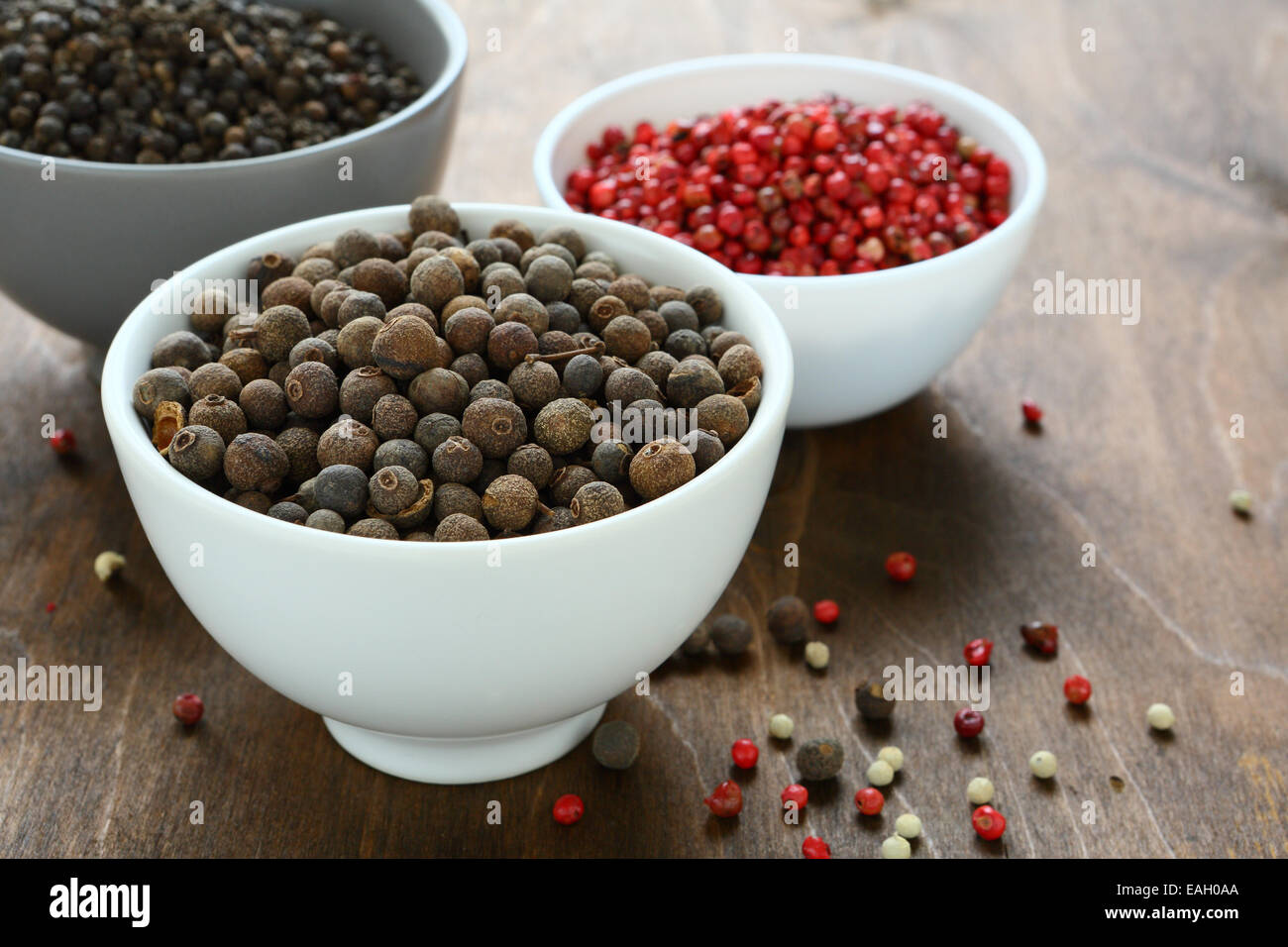 Three peppercorns background black hi-res stock photography and images ...
