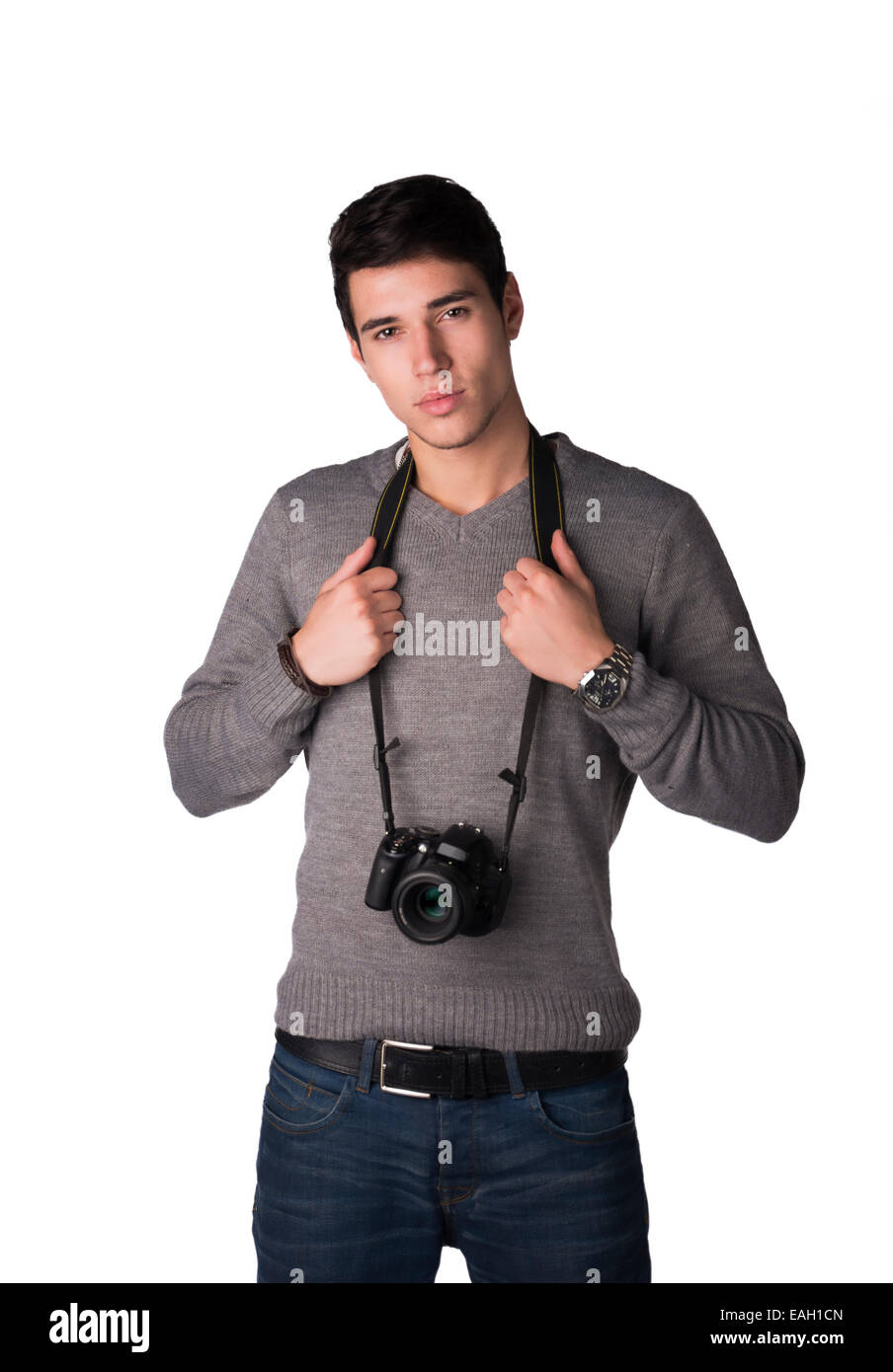Handsome young man with professional photo camera hanging from his neck ...