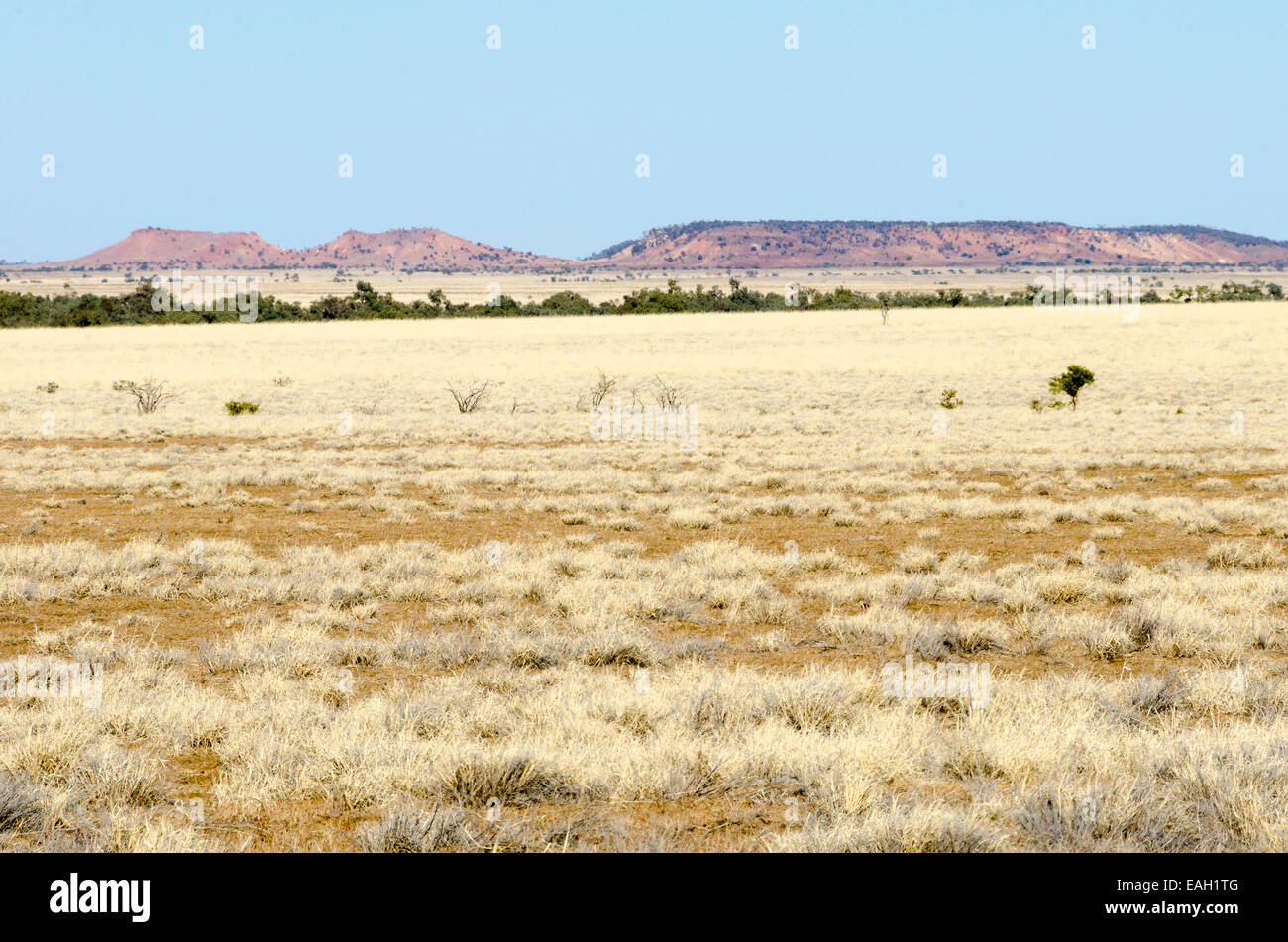 Flat desert with distant hills, near Winton, Queensland, Australia ...