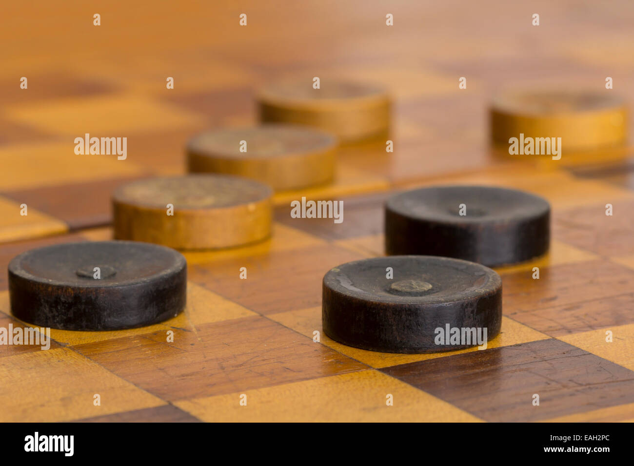 Close up of some old checkers on checker board Stock Photo - Alamy