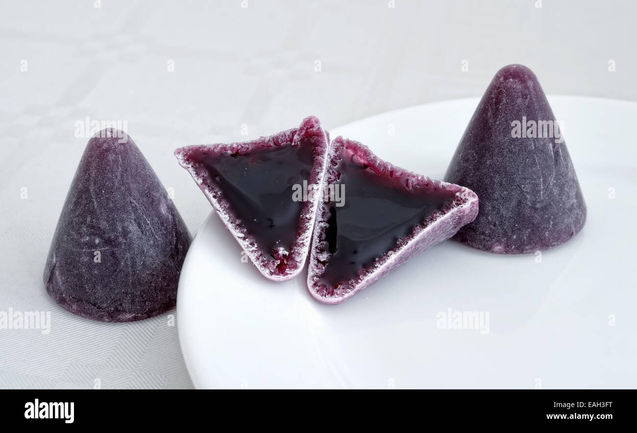 Purple traditional Belgian candies cuberdons on a white plate Stock ...