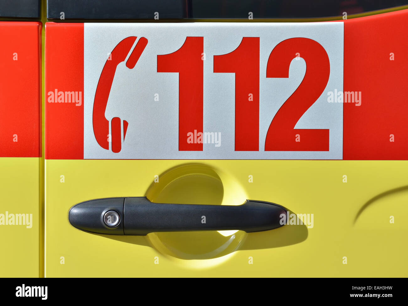Door of vehicle with European Emergency Number 112. This public service ...