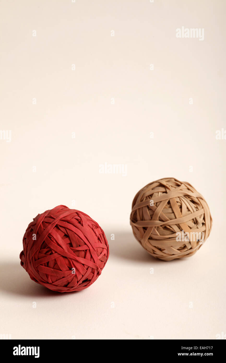 balls made up of red and fawn rubber bands Stock Photo - Alamy