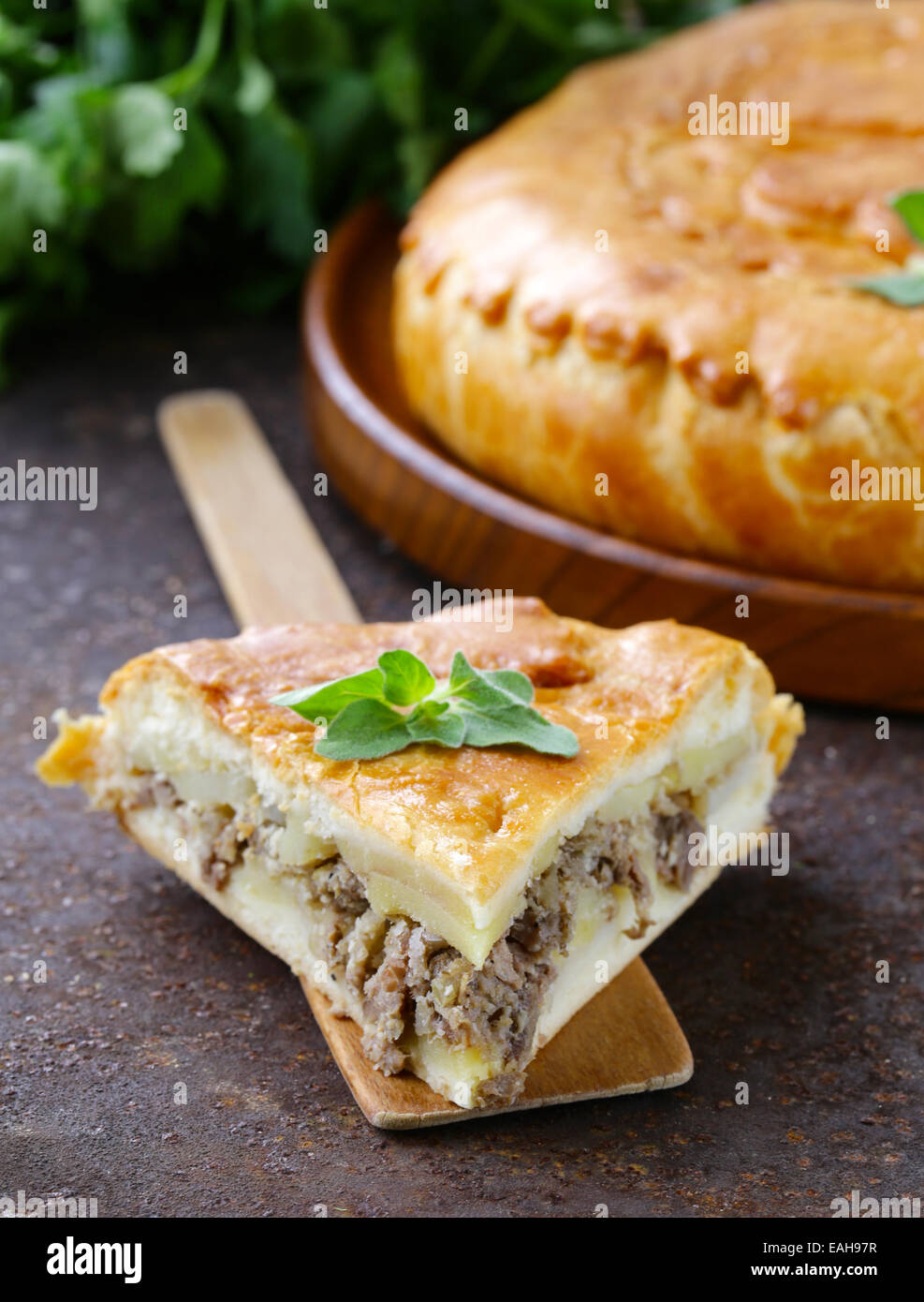 homemade meat pie with potatoes and oregano Stock Photo - Alamy
