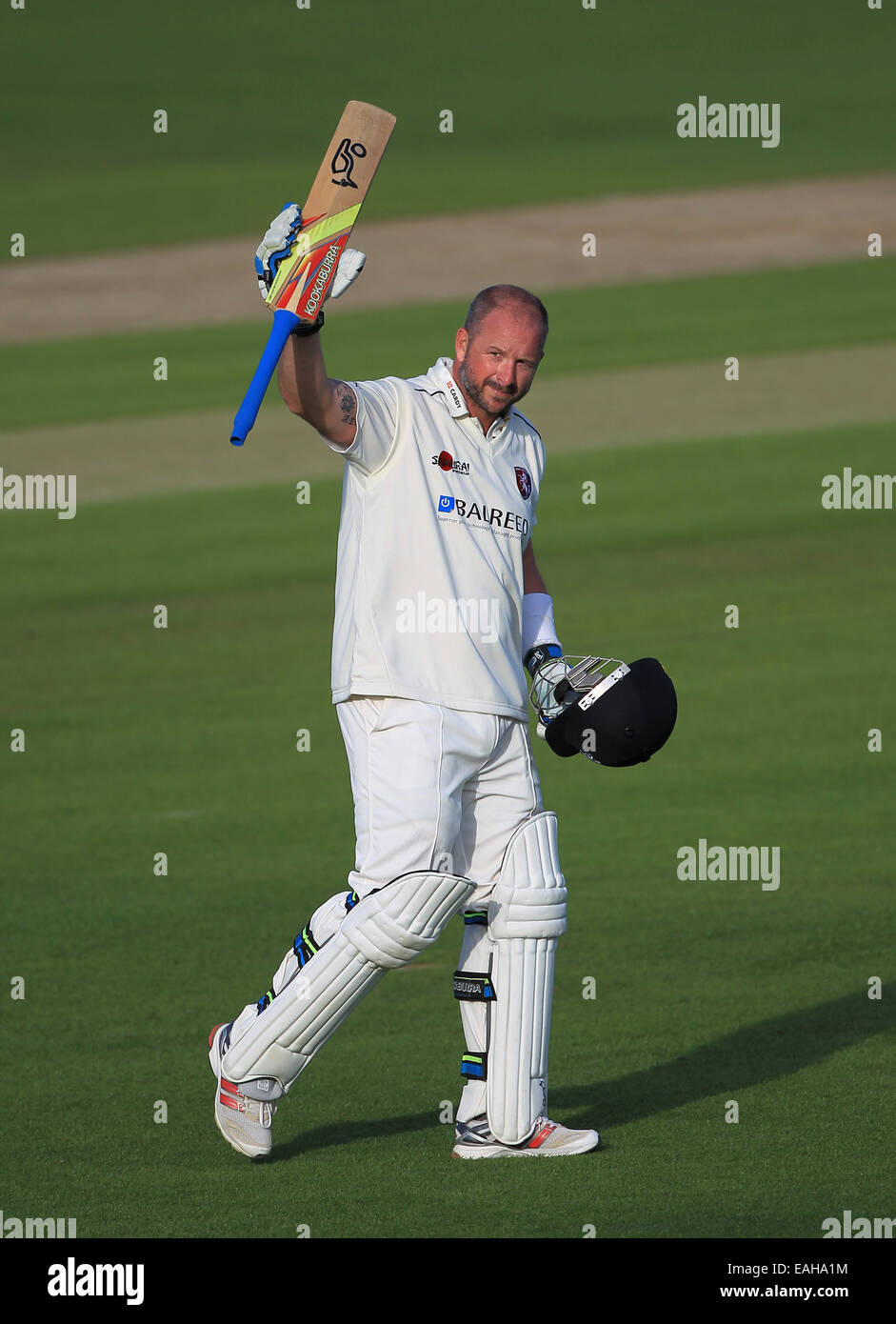 Darren Stevens of Kent raises his bat to celebrate reaching a century ...