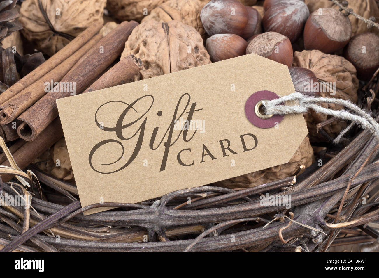 Gift card with nuts, cones and cinnamon Stock Photo - Alamy