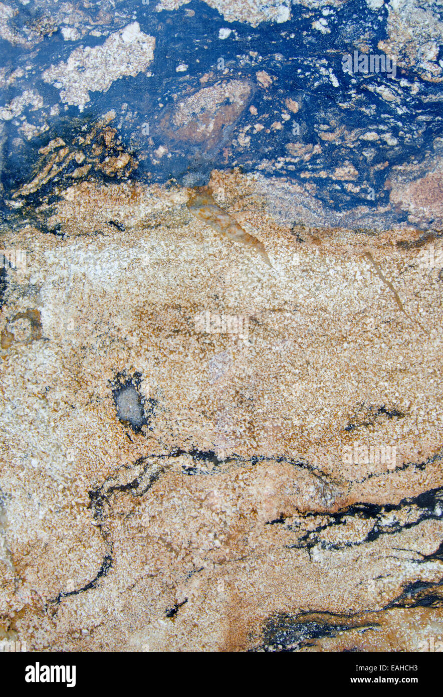 A full slab of cut and polished Granite makes a background of textures ...