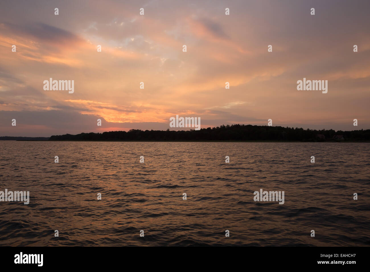 Sunset with beautiful sky over lake Stock Photo - Alamy