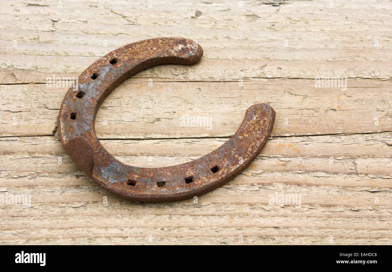 horseshoe on wooden ground Stock Photo - Alamy