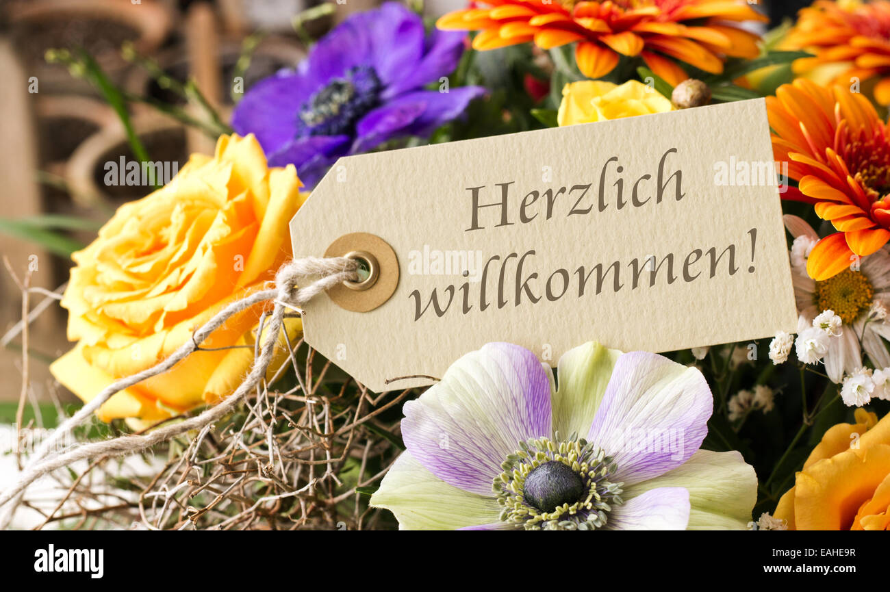 Bouquet with card: Welcome Stock Photo - Alamy