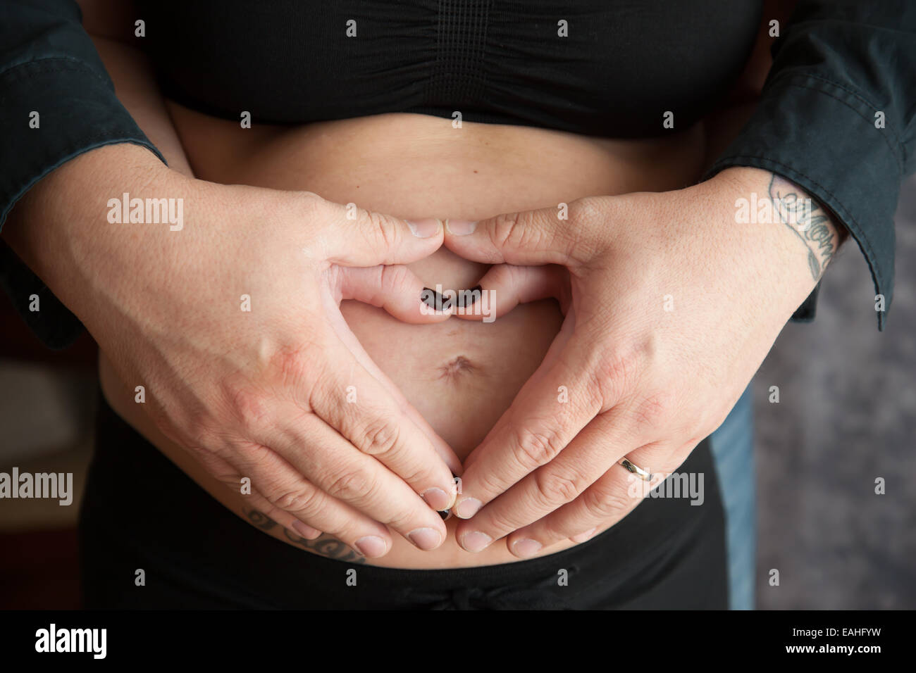 Heart Shaped Hands Stomach High Resolution Stock Photography and Images ...
