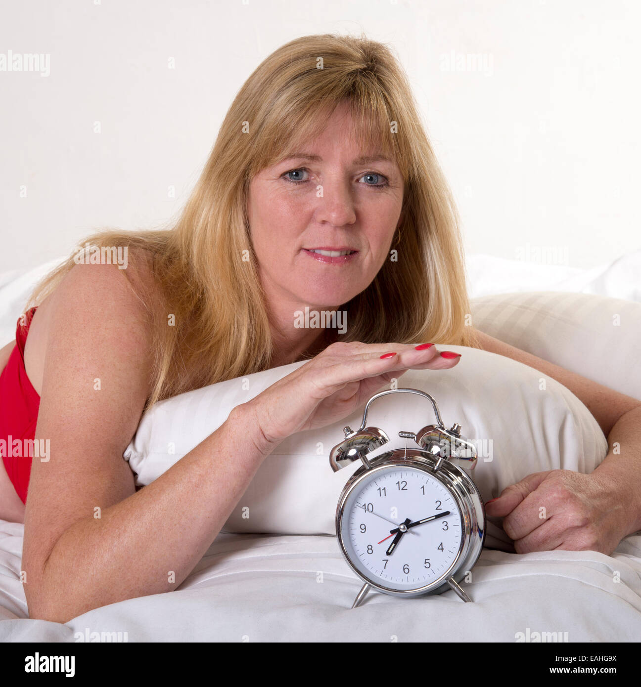 Woman clock bed hi-res stock photography and images - Alamy