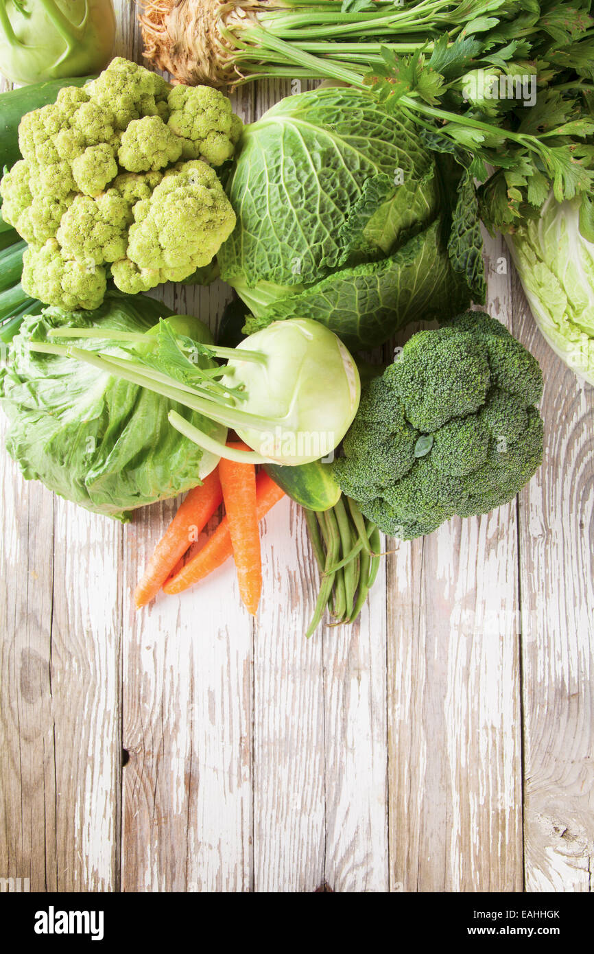 Various kinds of vegetable on wooden desk Stock Photo - Alamy