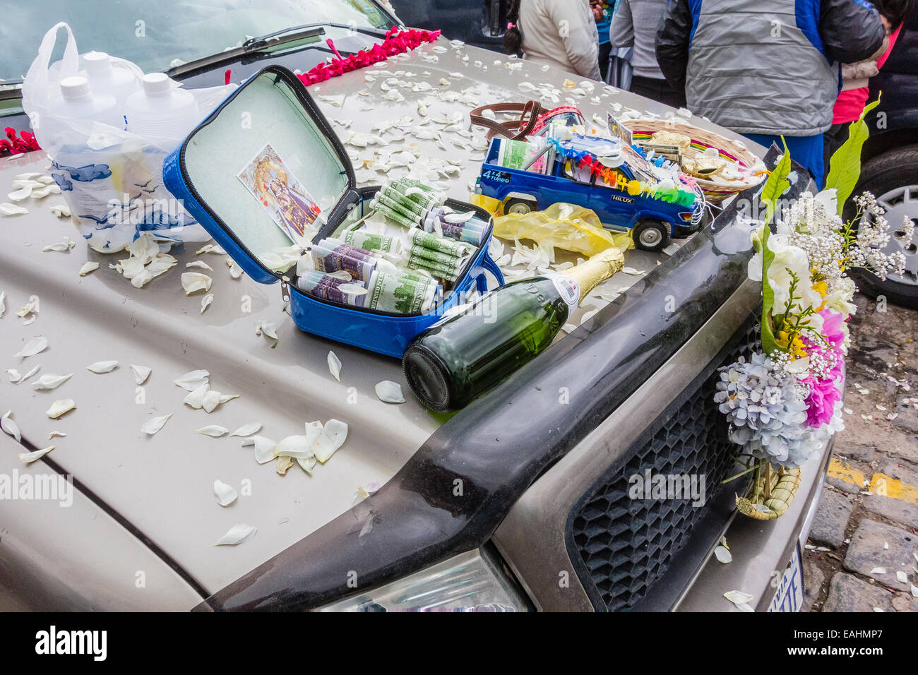 Objects laid out on the hood of a truck for good luck and wishes for ...
