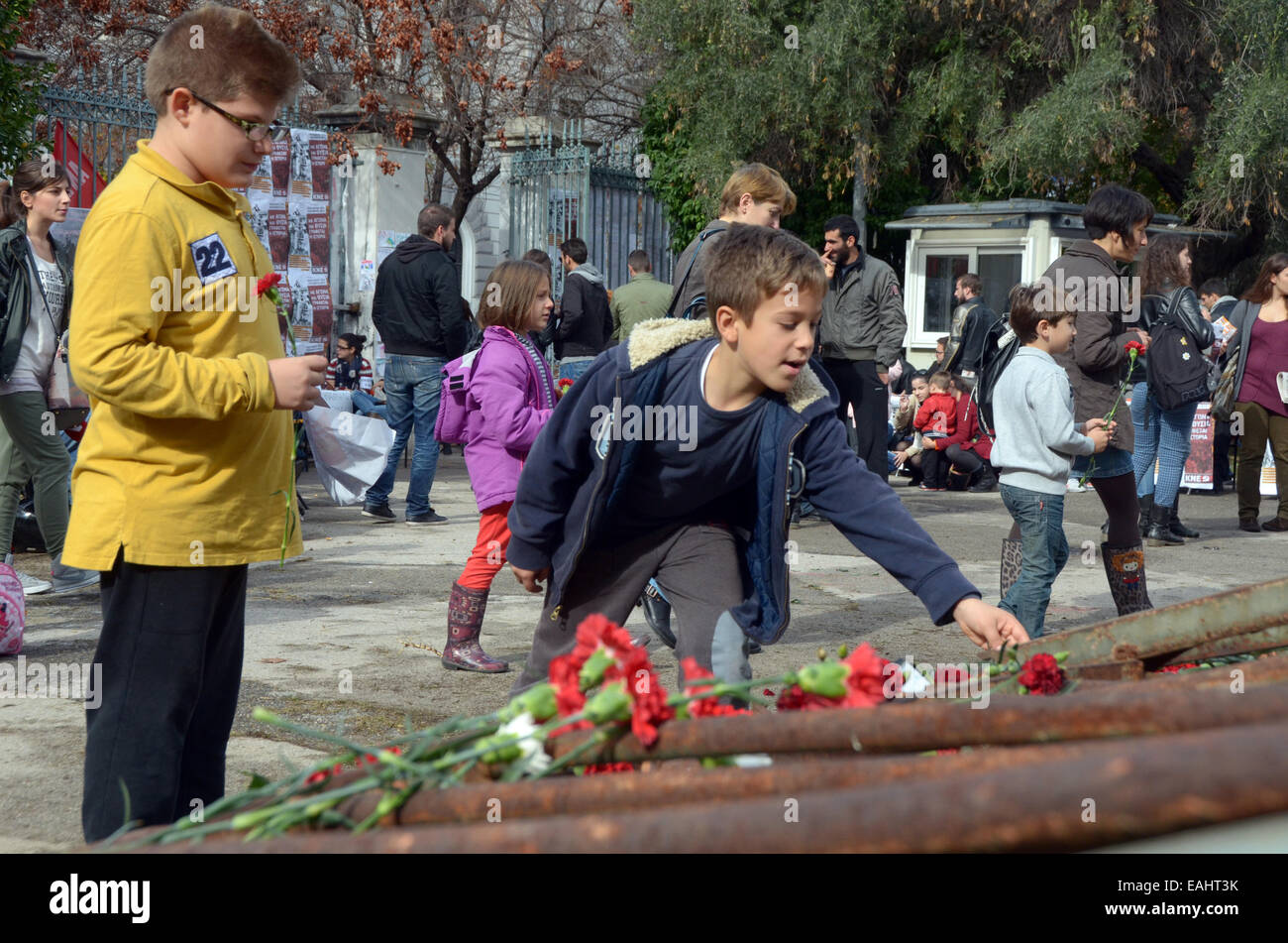 Students put red flowers in the gate that was crashed in 1973 by a tank ...